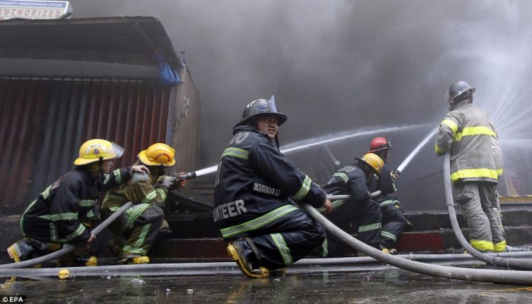 Philippine firefighters rein in second mall blaze in two weeks